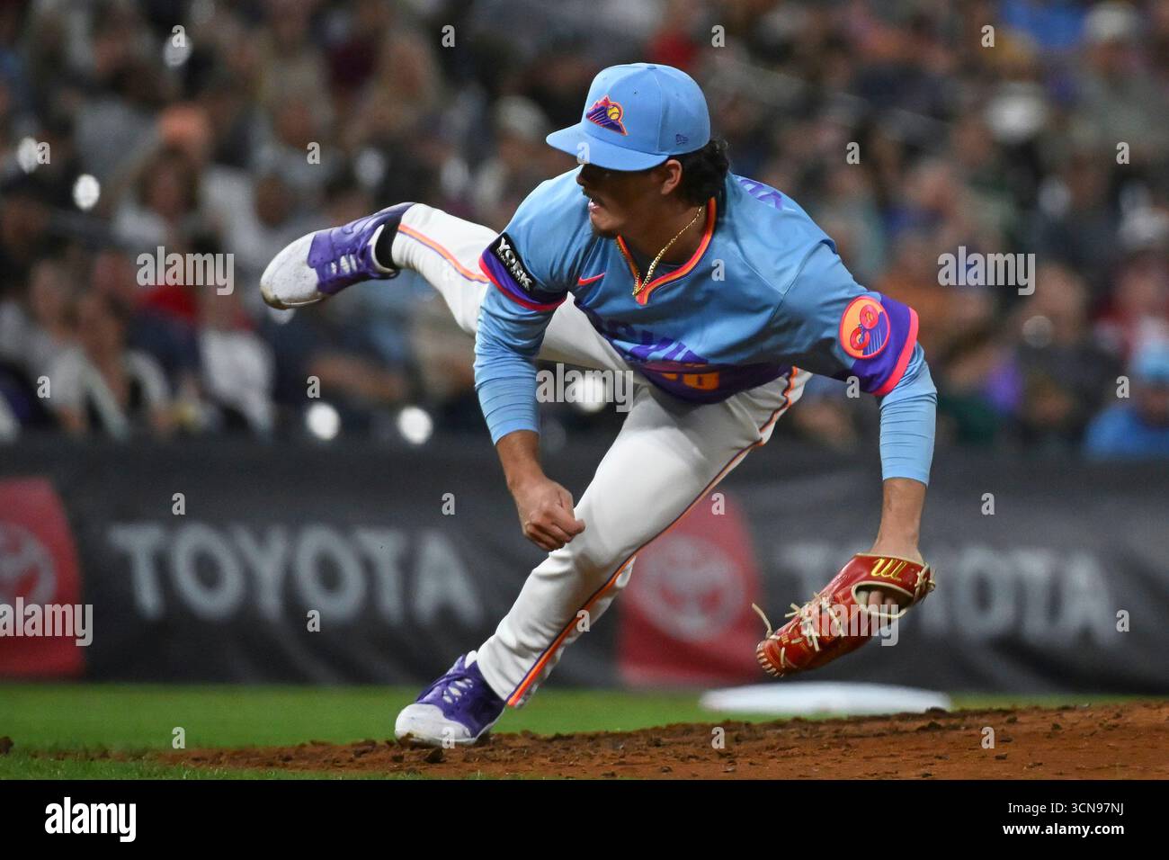 Colorado Rockies closing pitcher Victor Vodnik slips after a pitch in ...
