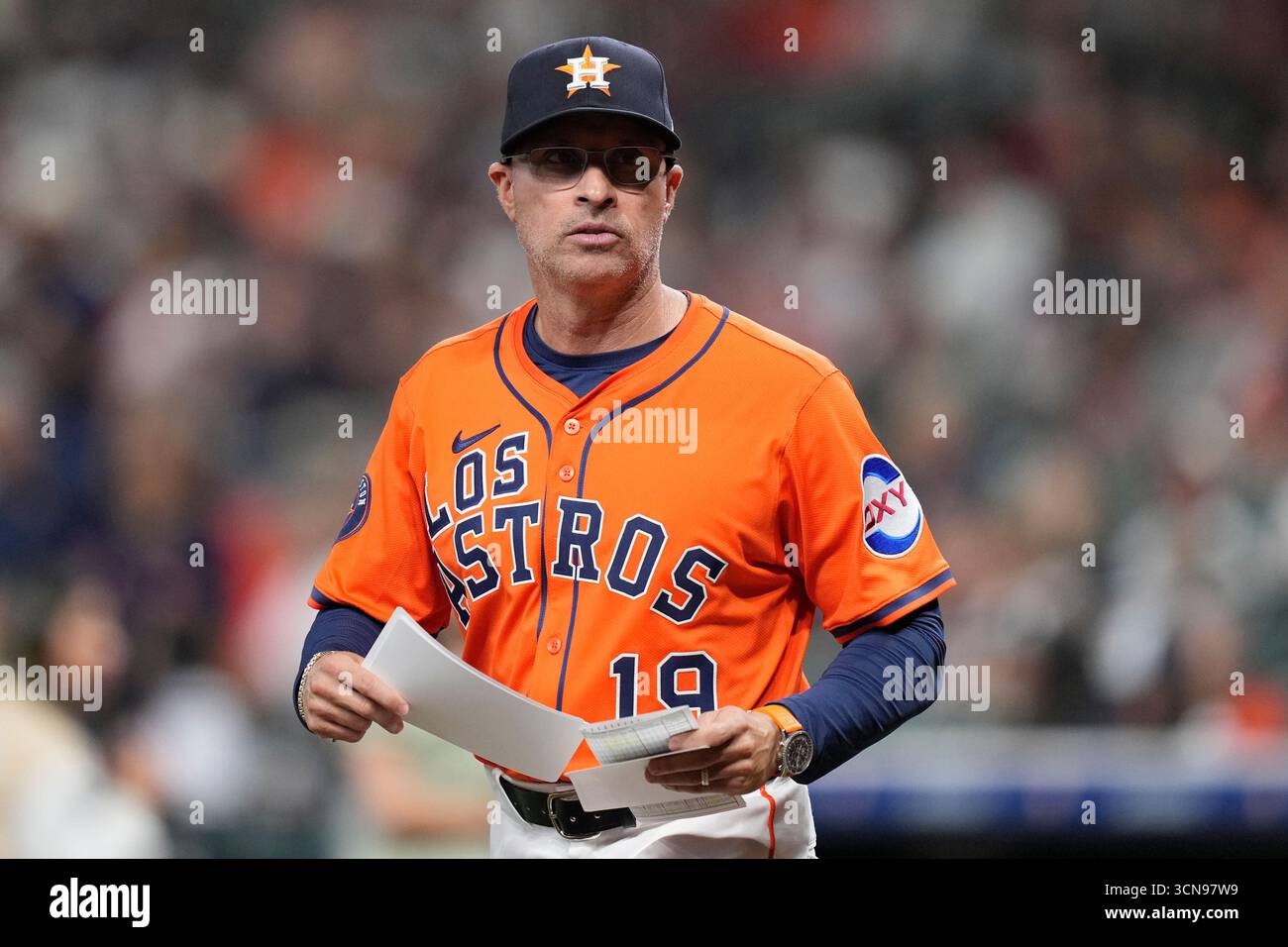 Houston Astros manager Joe Espada (19) takes the lineup to home plate ...