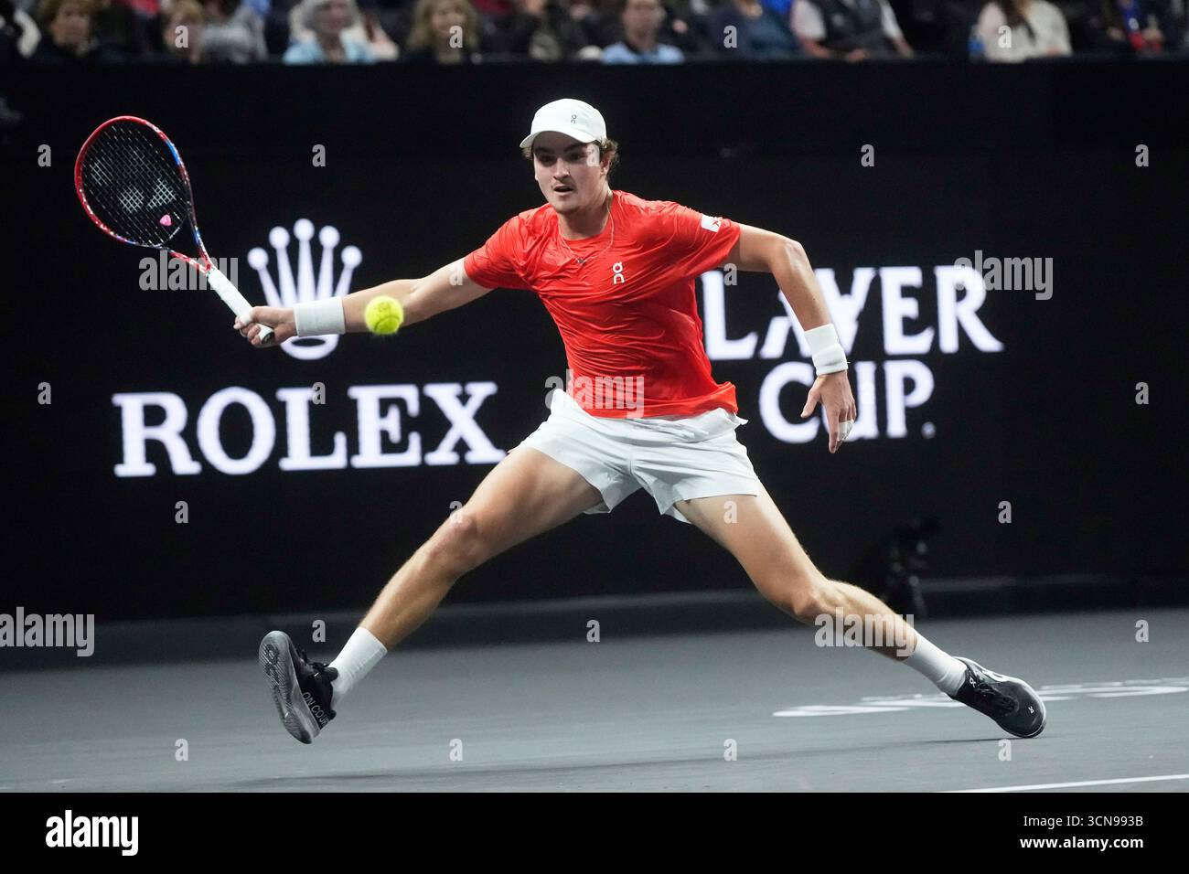 Team World's João Fonseca, of Brazil, returns a shot against Team ...