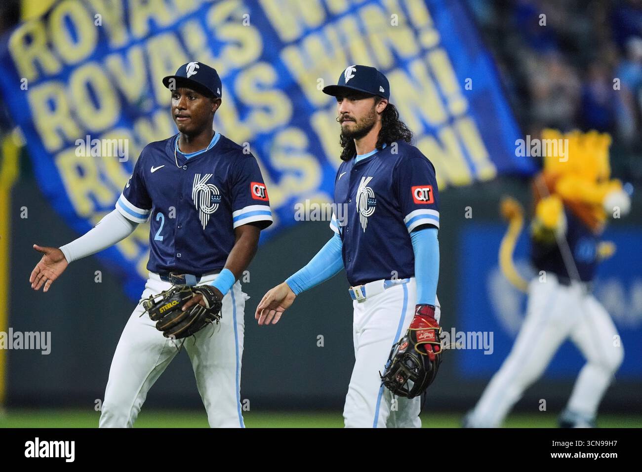 Kansas City Royals' Tyler Tolbert (2) and Jonathan India walk off the ...