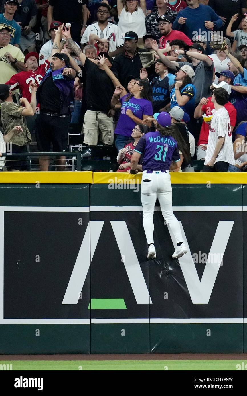 Arizona Diamondbacks left fielder Jake McCarthy leaps in vain for a ...