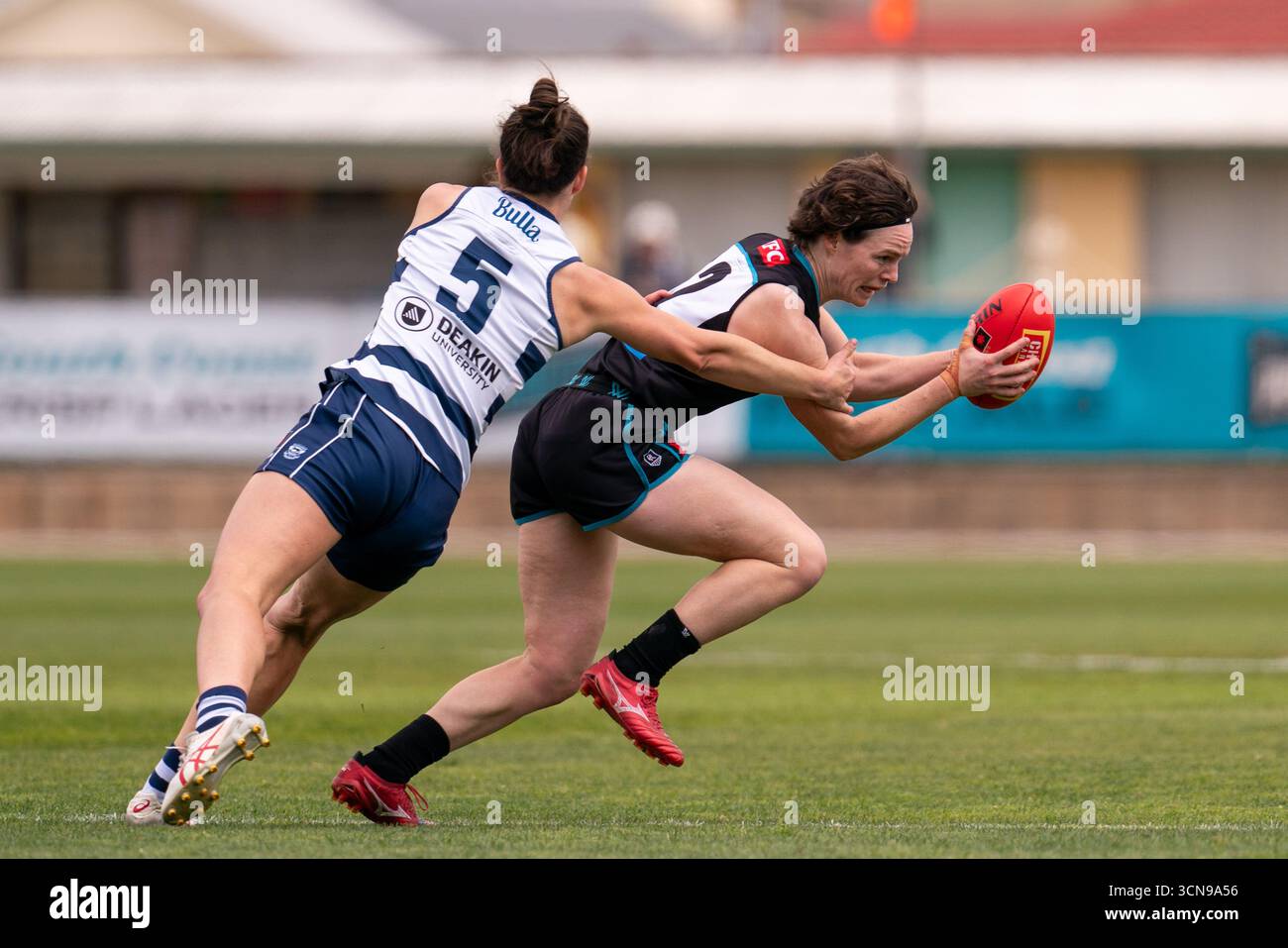 Ebony O'Dea (2 Port Adelaide) is tackled by Jacqueline Parry (5 Geelong ...
