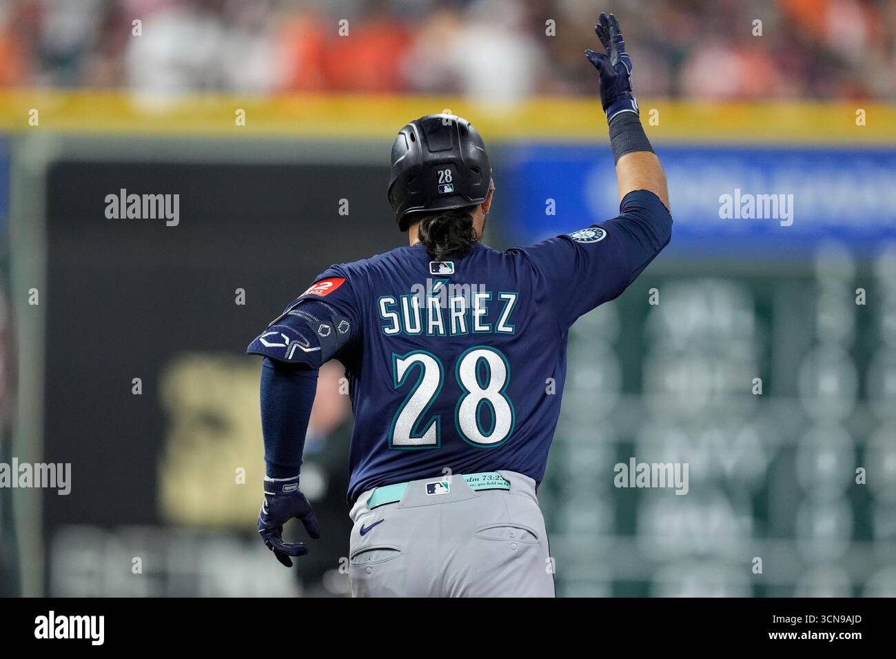 Seattle Mariners' Eugenio Suárez runs the bases after hitting a solo ...