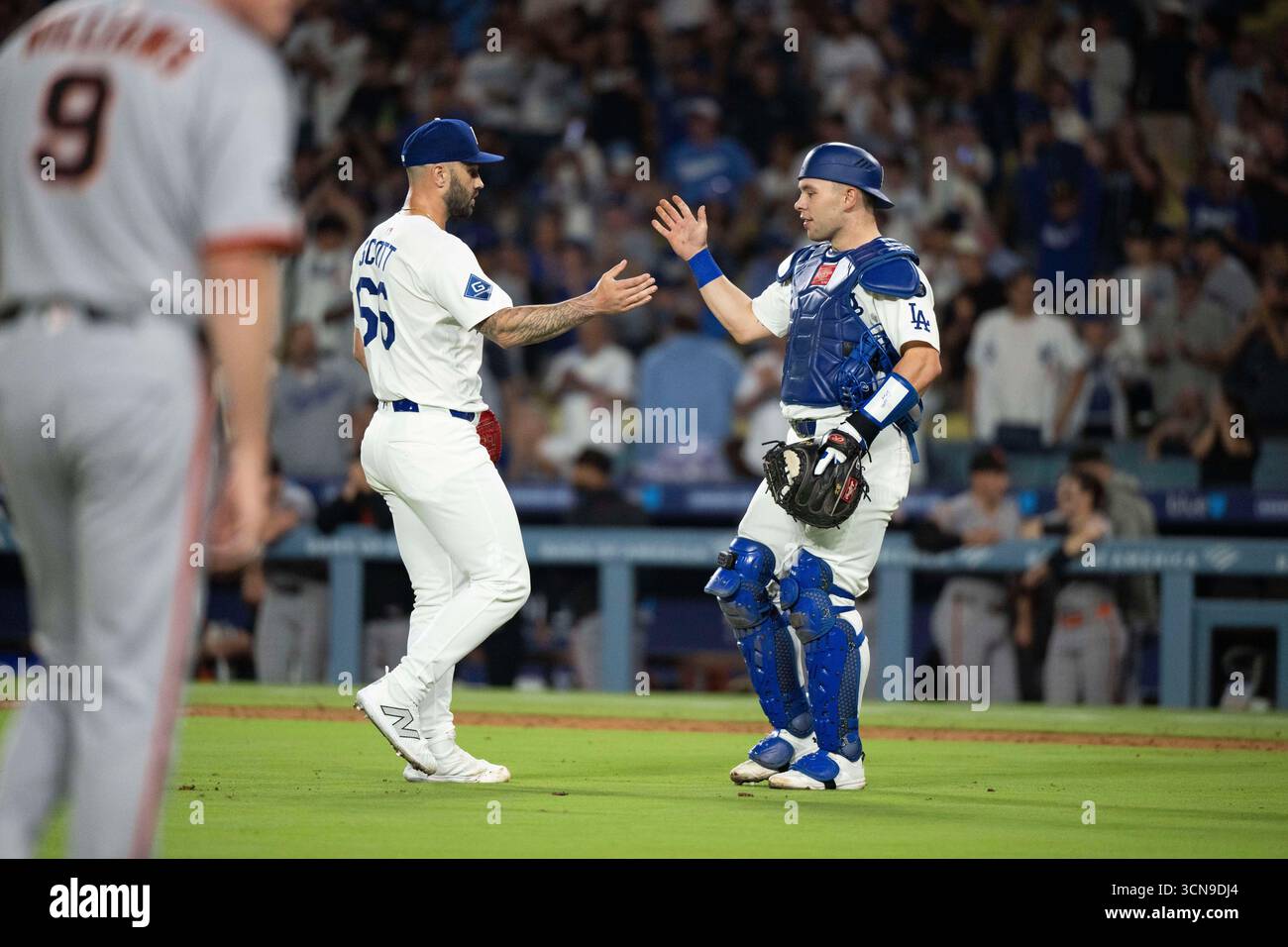 Los Angeles Dodgers relief pitcher Tanner Scott, left, and catcher ...