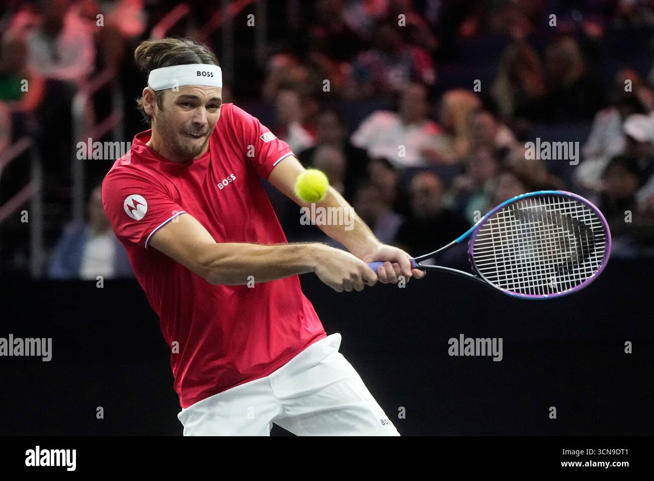 Team World's Taylor Fritz, of the United States, returns a shot against ...