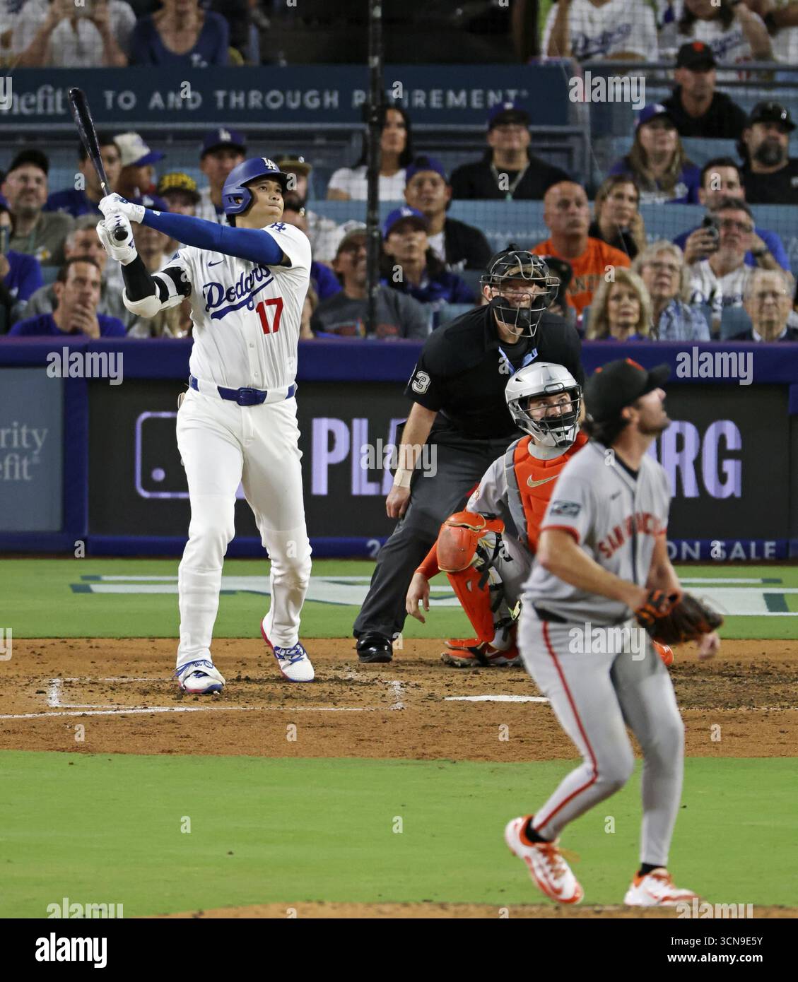 Los Angeles Dodgers designated hitter Shohei Ohtani hits a three-run ...