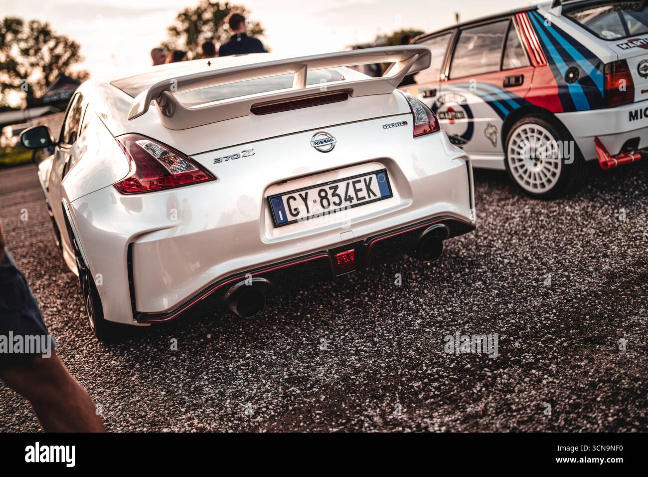 Milan, italy 20 september 2025: two iconic sports cars, a white nissan ...