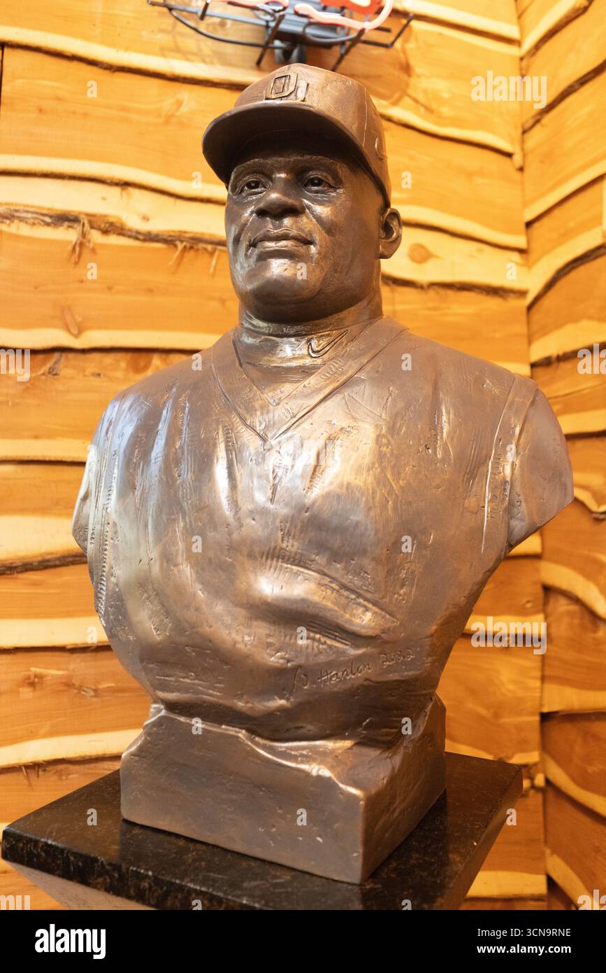 A statue of John Blake is displayed at Coach’s Corner Norman to honor ...