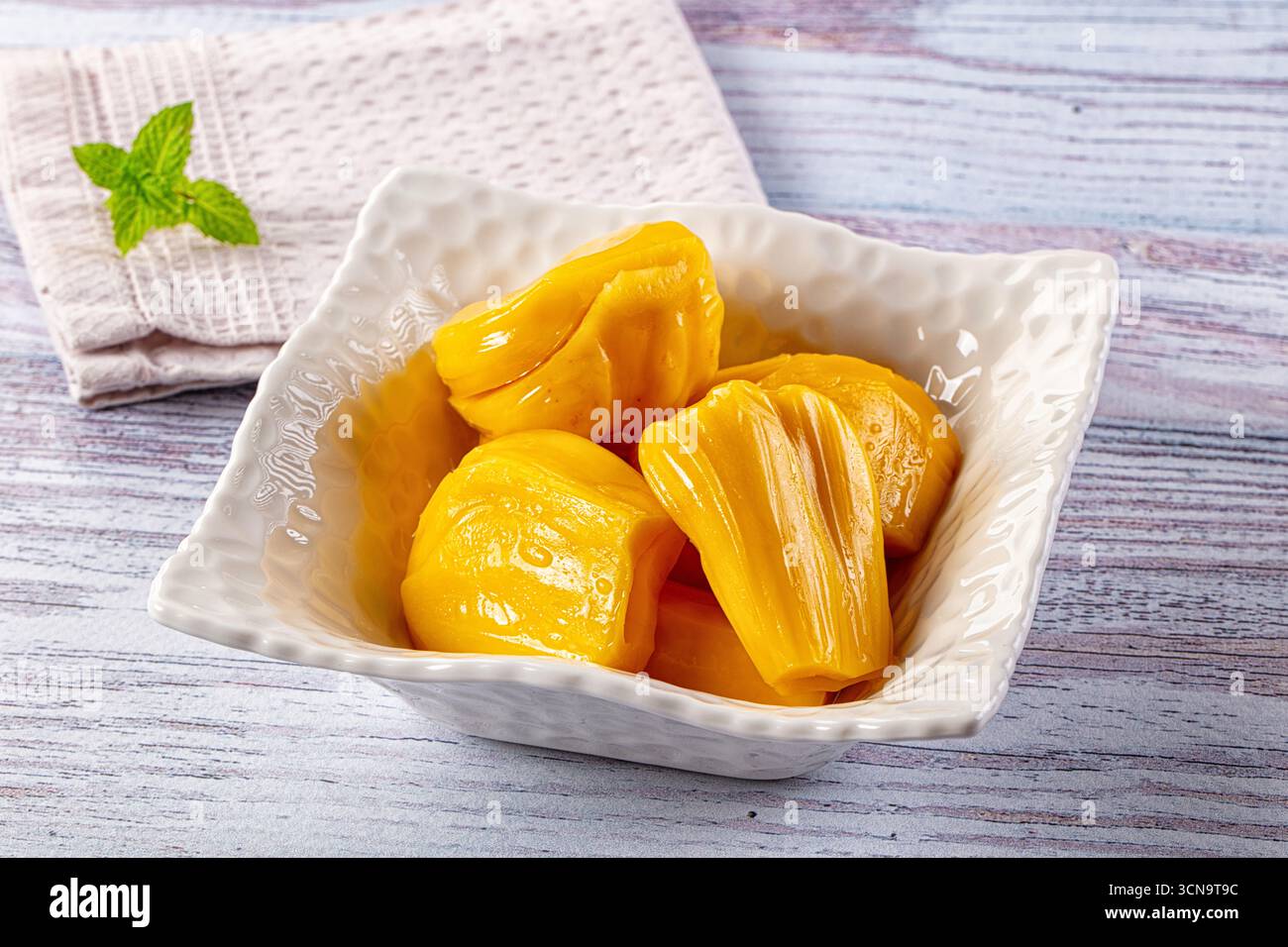 Canned sweet juicy yellow Jackfruit segment Stock Photo - Alamy