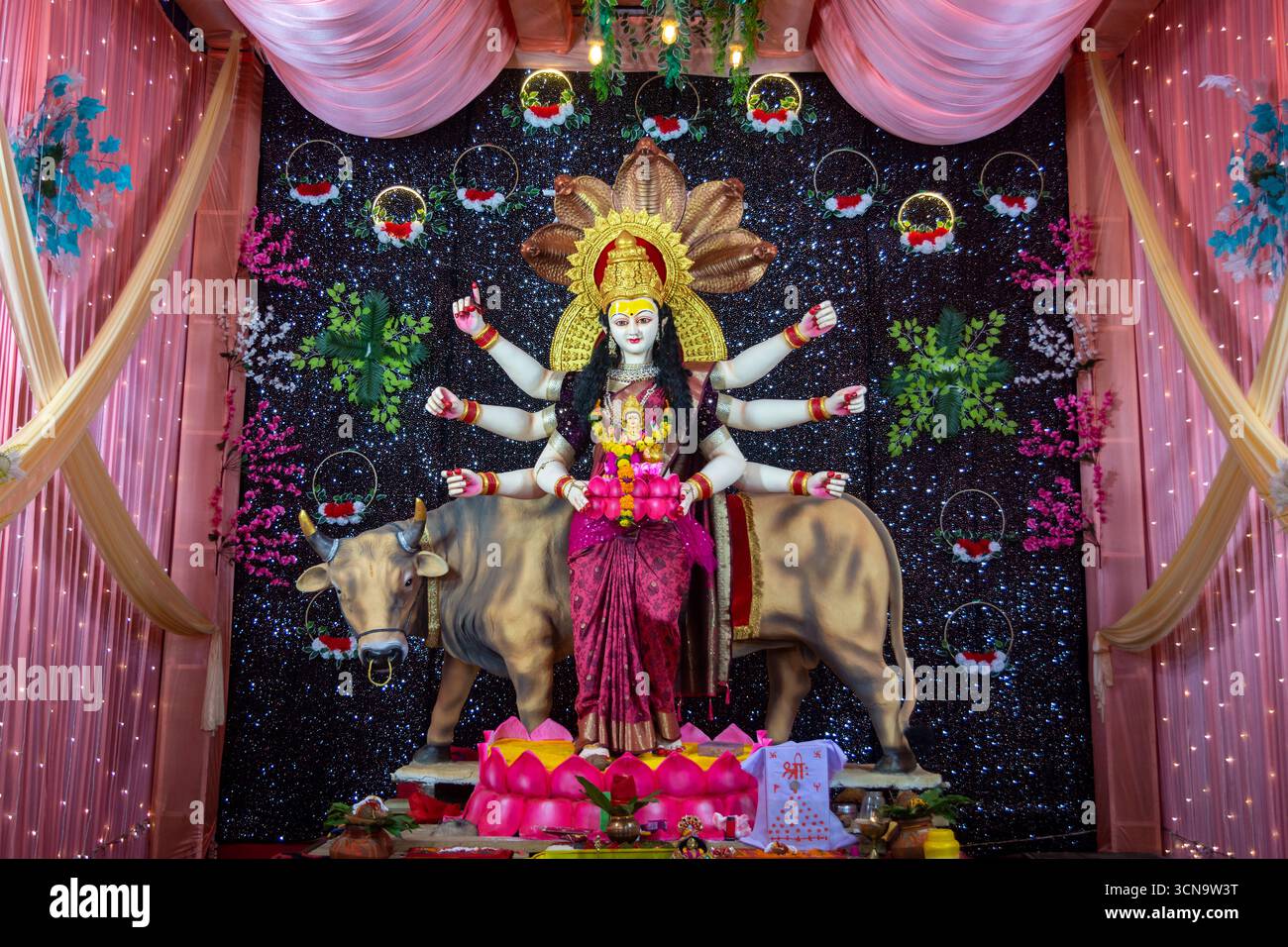 Beautifully decorated idol of Goddess Durga placed in a festive pandal ...
