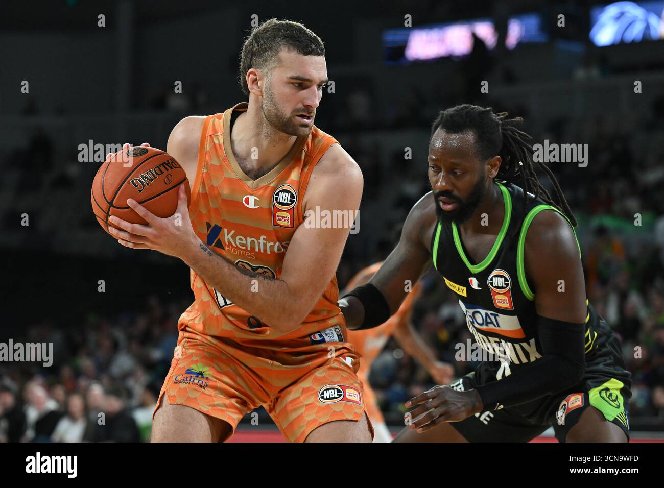 Jack McVeigh of the Taipans (left) in action against Gorjok Gak of the ...