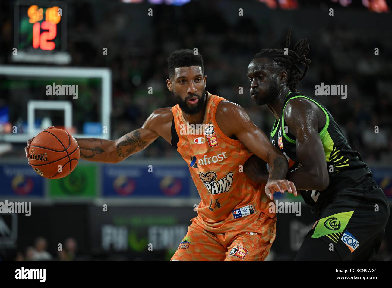 Marcus Lee of the Taipans (left) in action against Gorjok Gak of the ...