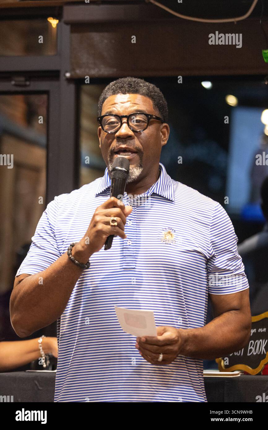 Pastor Michael McDaniel speaks at Coach’s Corner Norman to honor former ...