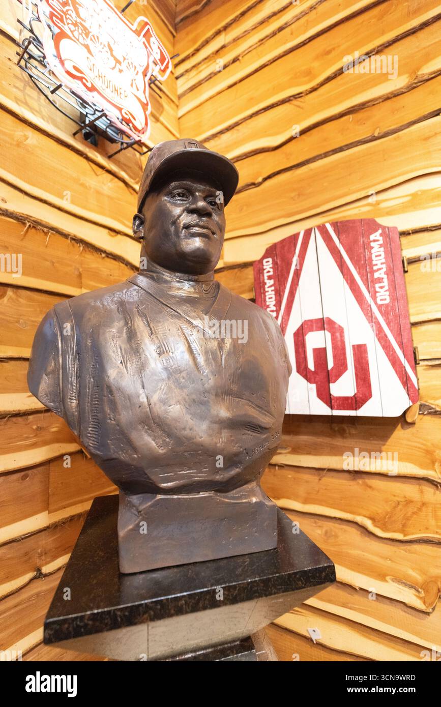 A statue of John Blake is displayed at Coach’s Corner Norman to honor ...