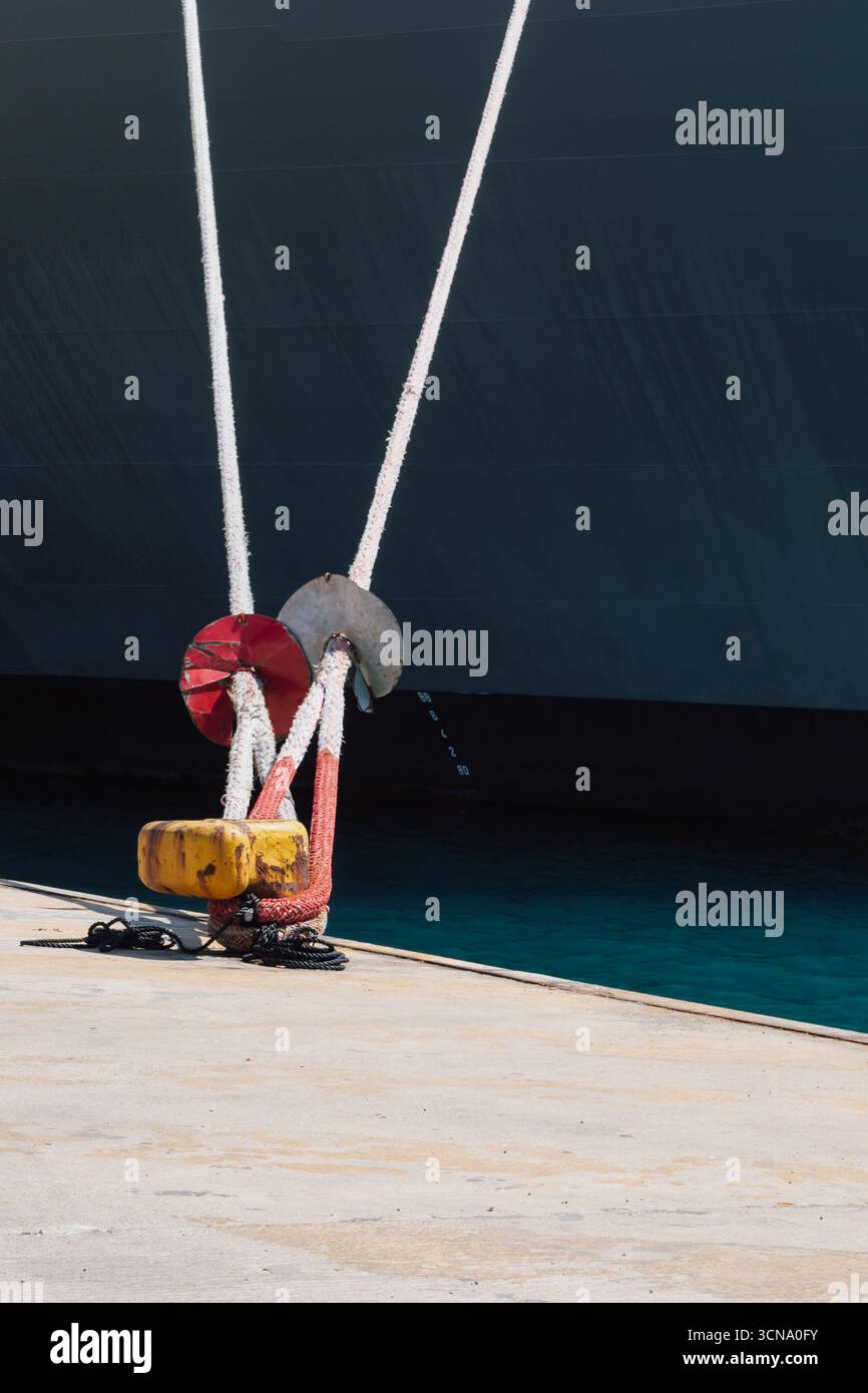 Mooring of a vessel in the port using mooring lines to a bollard on the ...