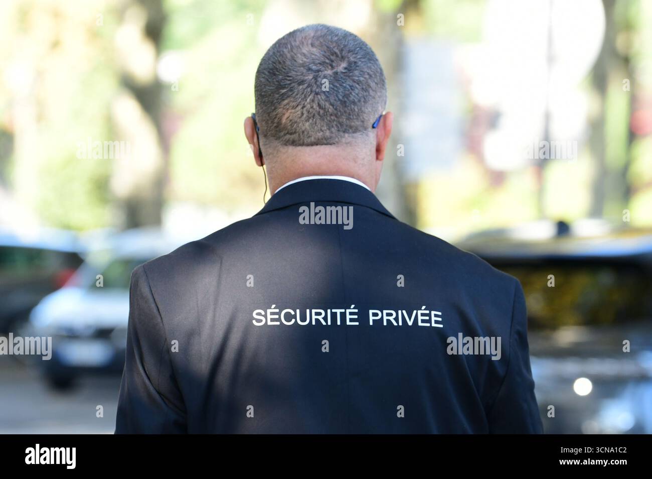 A private security guard provides security at the Saint-Étienne Fair. (Photo by Romain Doucelin ...