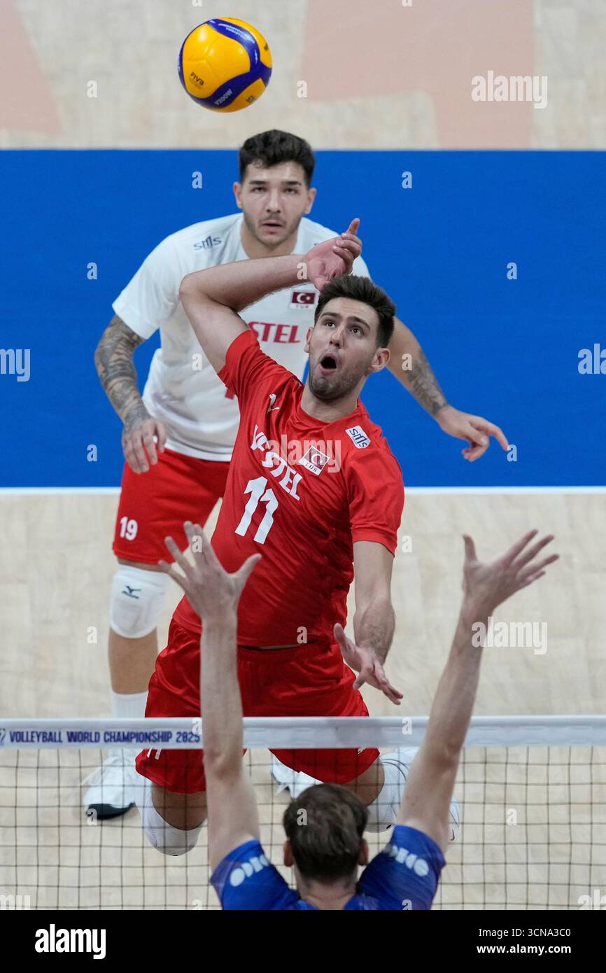 Mirza Lagumdzija of Turkey spikes the ball against Cornelis Luuc van ...