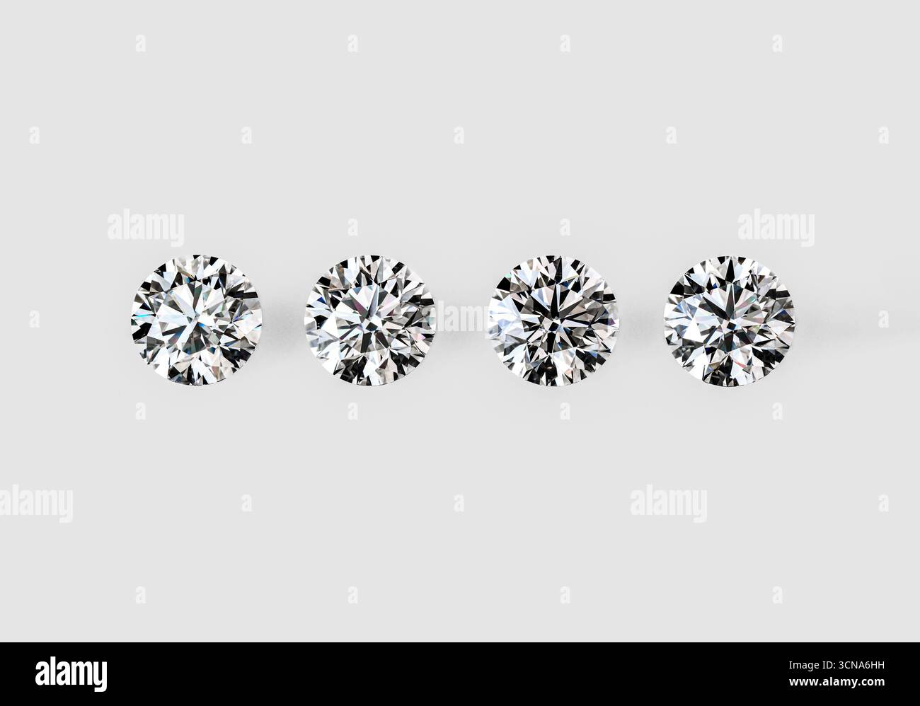 Four diamonds are lined up in a row. The diamonds are all the same size ...