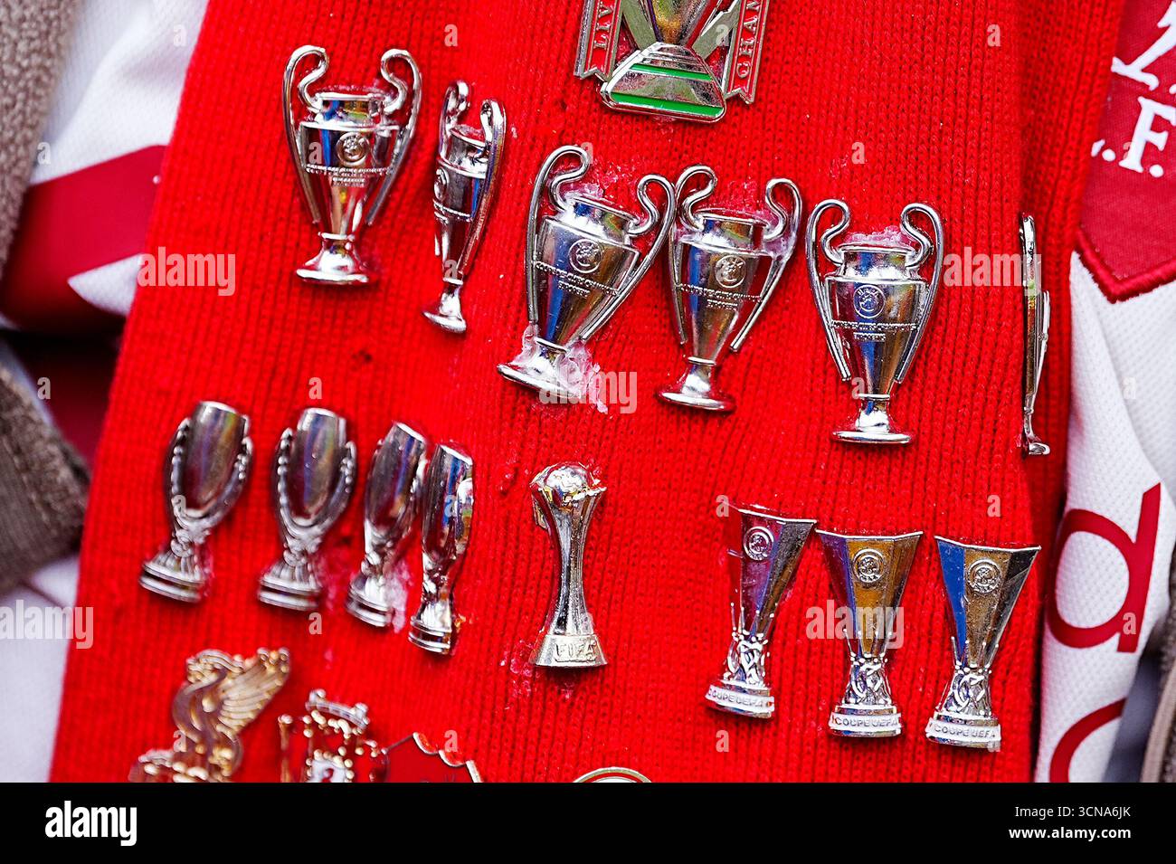 Liverpool pin badges ahead of the Premier League match at Anfield ...