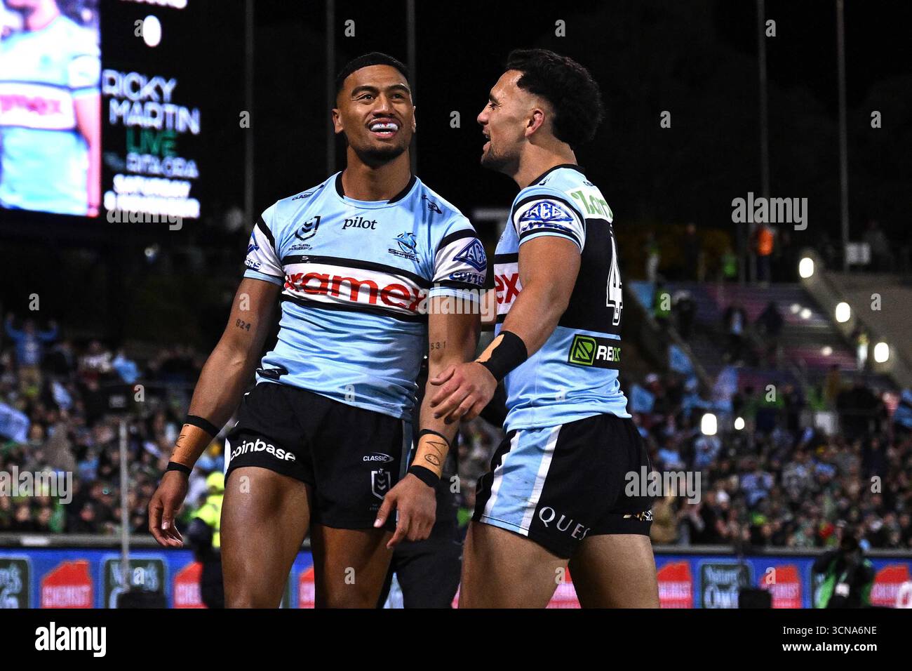 Ronaldo Mulitalo of the Sharks (left) celebrates with KL Iro after ...