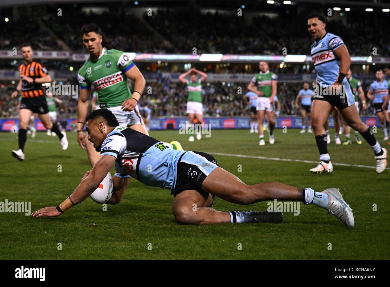 Ronaldo Mulitalo of the Sharks scores a try during the NRL Semi-Final ...
