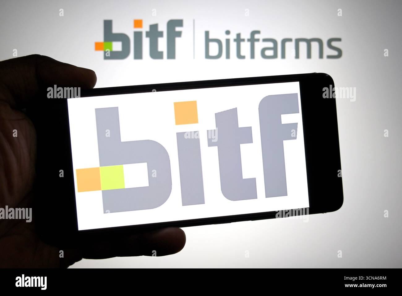 In this photo illustration, a Bitfarms logo seen displayed on a ...