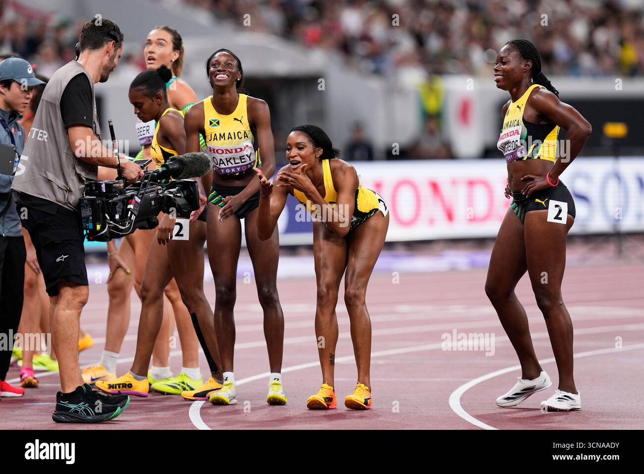 Team Jamaica celebrates after a women's 4 X 400 meters relay heat at ...