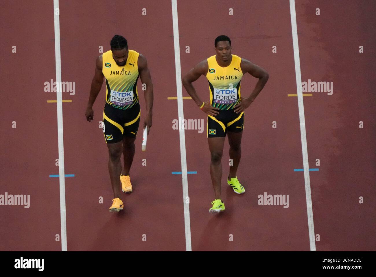 Jamaica's Ryiem Forde, right, walks with Jamaica's Kishane Thompson ...