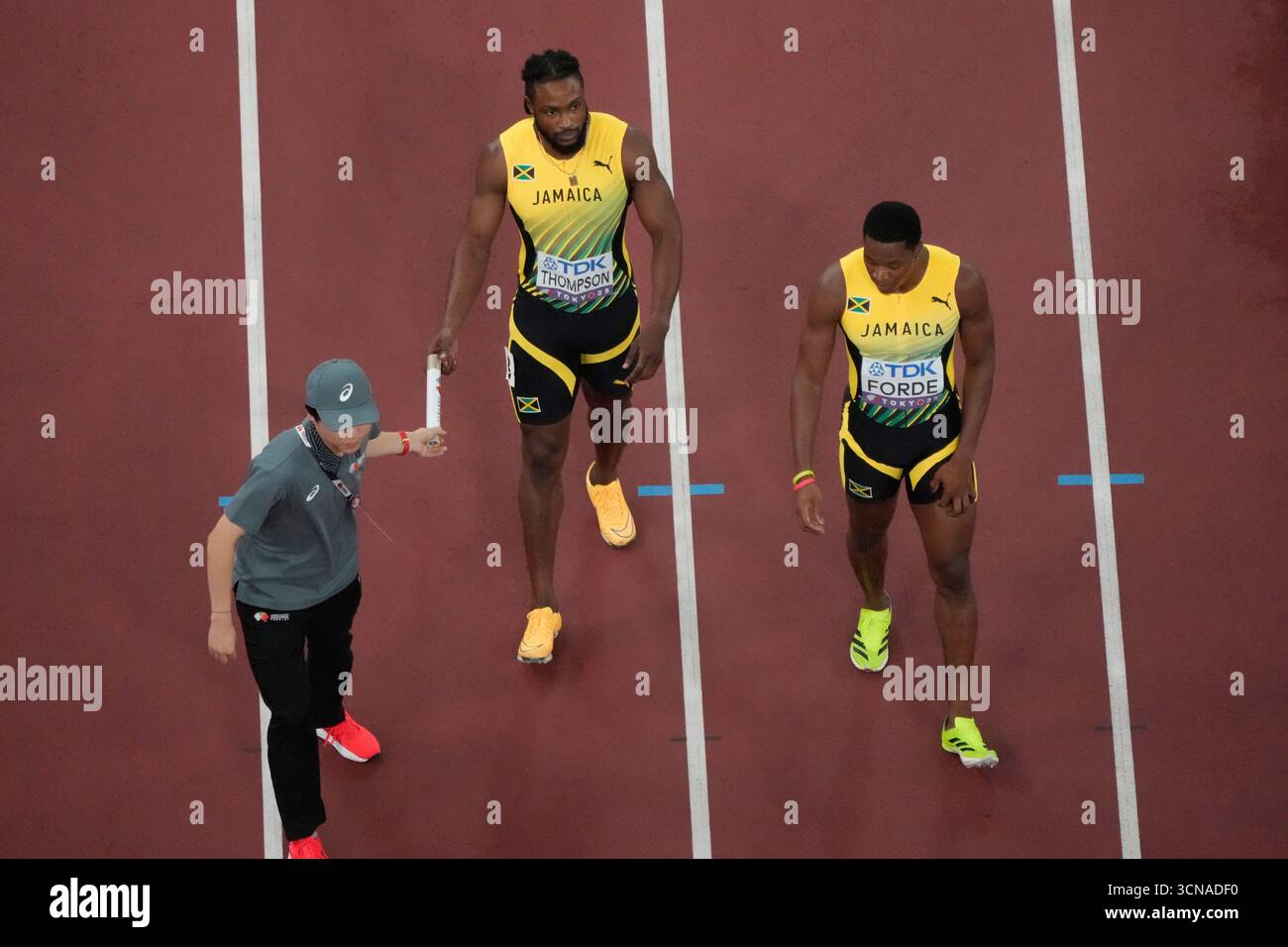 Jamaica's Ryiem Forde, right, walks with Kishane Thompson as he hands ...