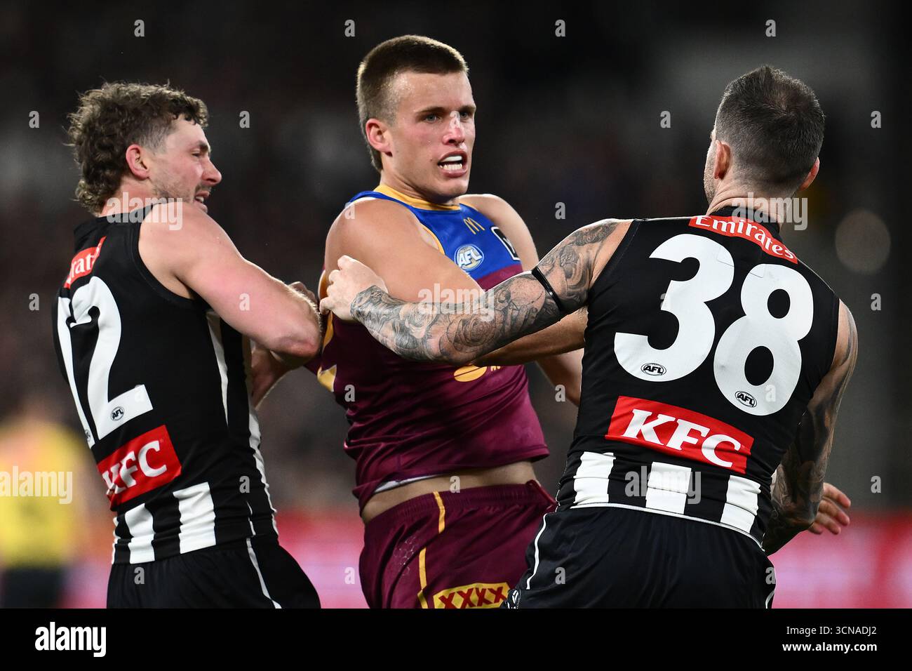 Ty Gallop of the Lions scuffles with Jeremy Howe of Collingwood during ...
