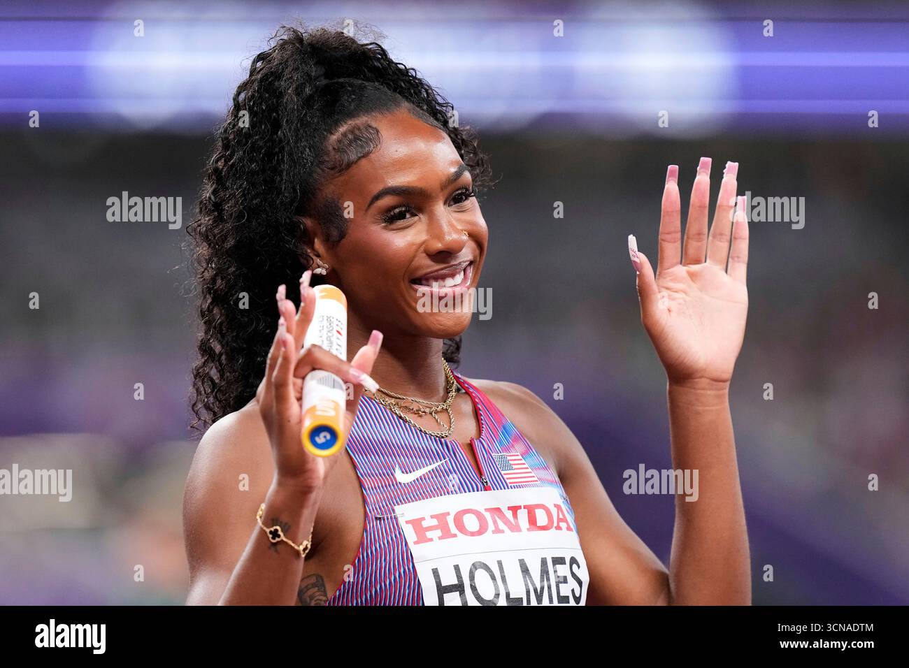 United States' Alexis Holmes reacts after a women's 4 X 400 meters ...