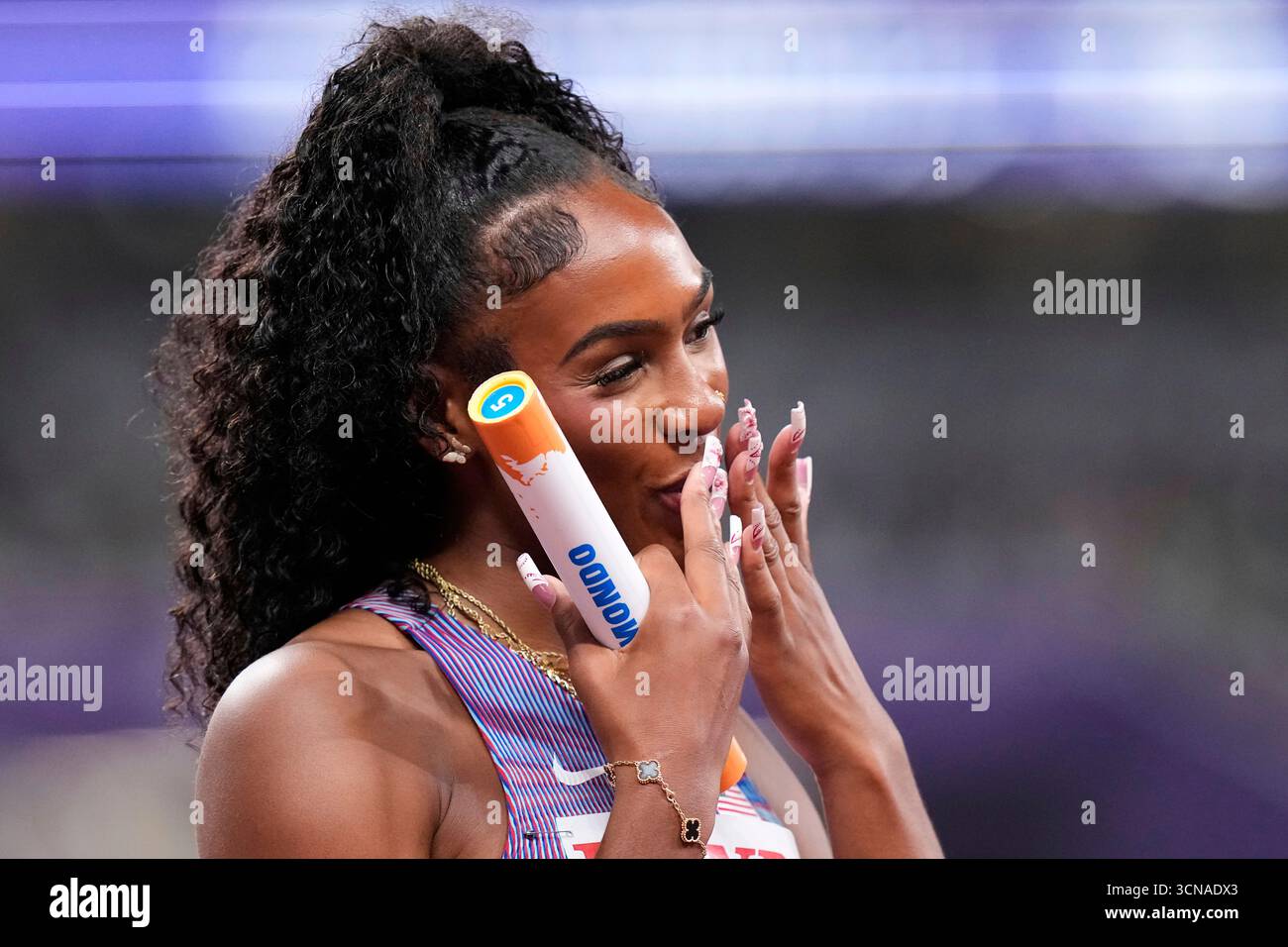 United States' Alexis Holmes reacts after a women's 4 X 400 meters ...