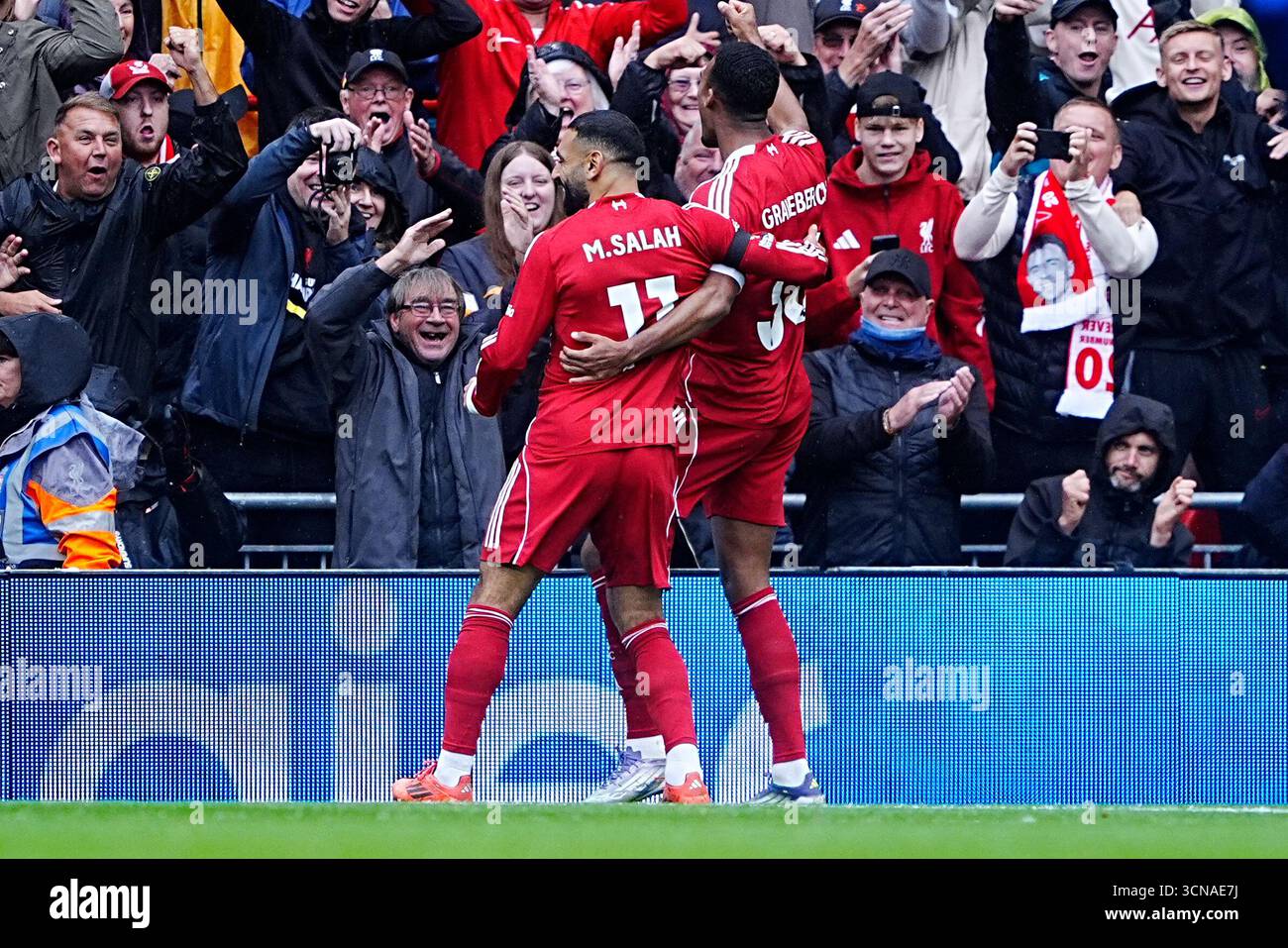 Liverpool's Ryan Gravenberch (right) celebrates scoring their side's ...