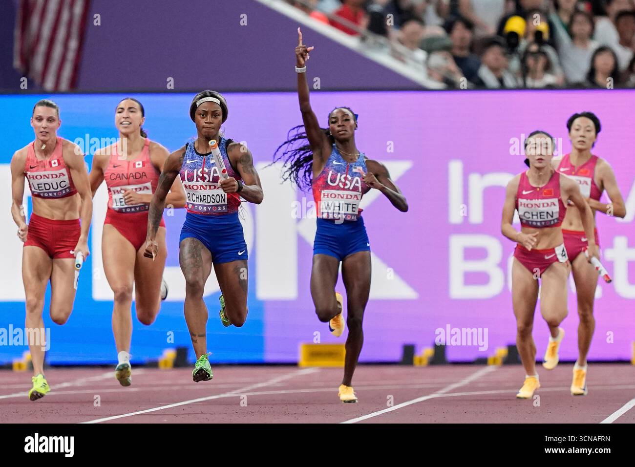United States' Sha'Carri Richardson races her team to win a women's 4 X ...