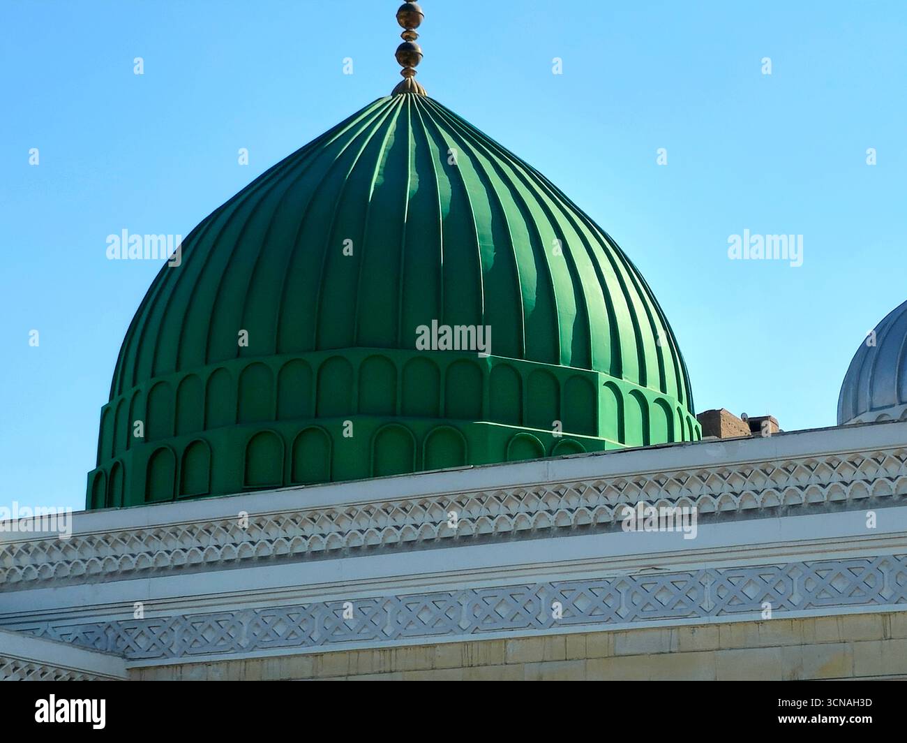Exterior details of a grand large mosque in Cairo with green dome, a ...