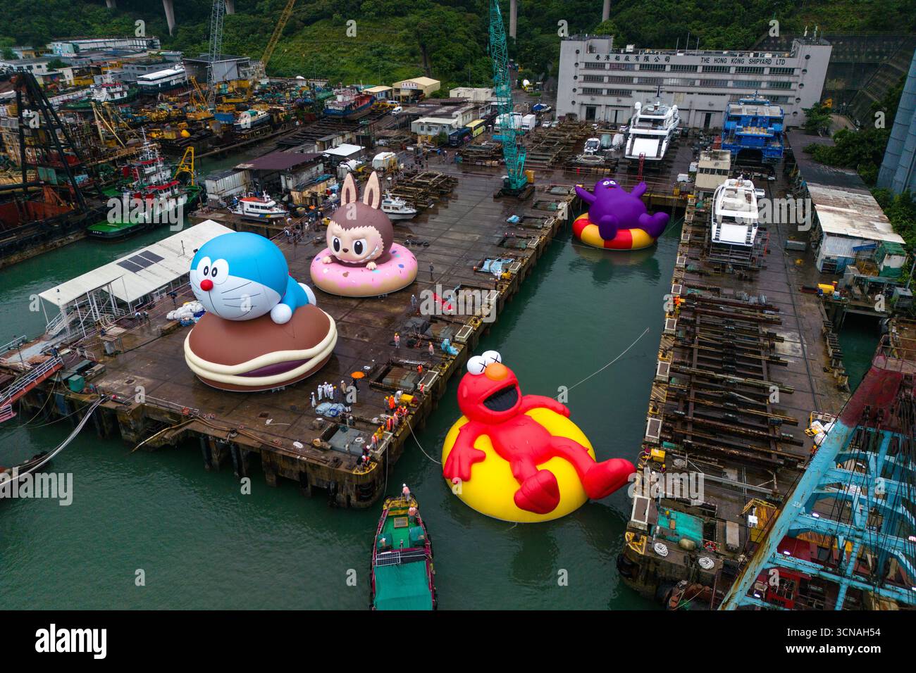 An aerial photograph showing large inflatable sculptures themed after ...