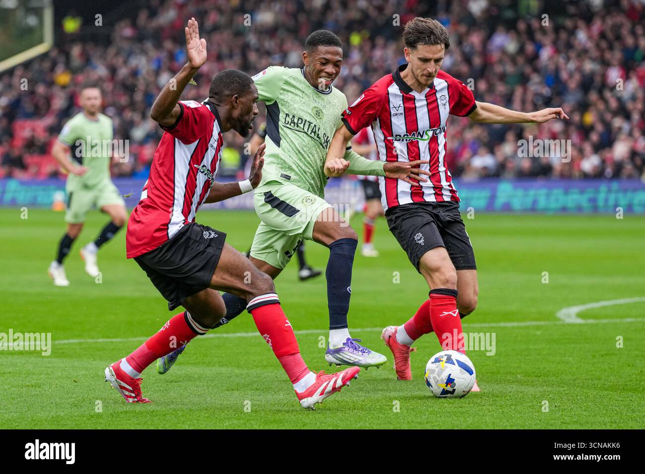 Zack Nelson (37) of Luton Town (centre) during the Sky Bet League 1 ...