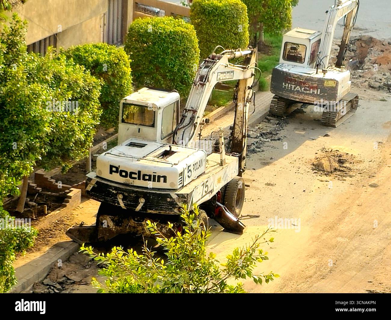 Cairo, Egypt, September 6 2025: demolition hydraulic crawler excavators ...