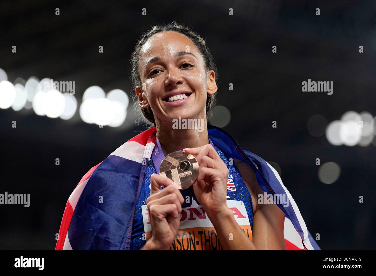 Britain's Katarina Johnson-Thompson celebrates with her bronze medal ...