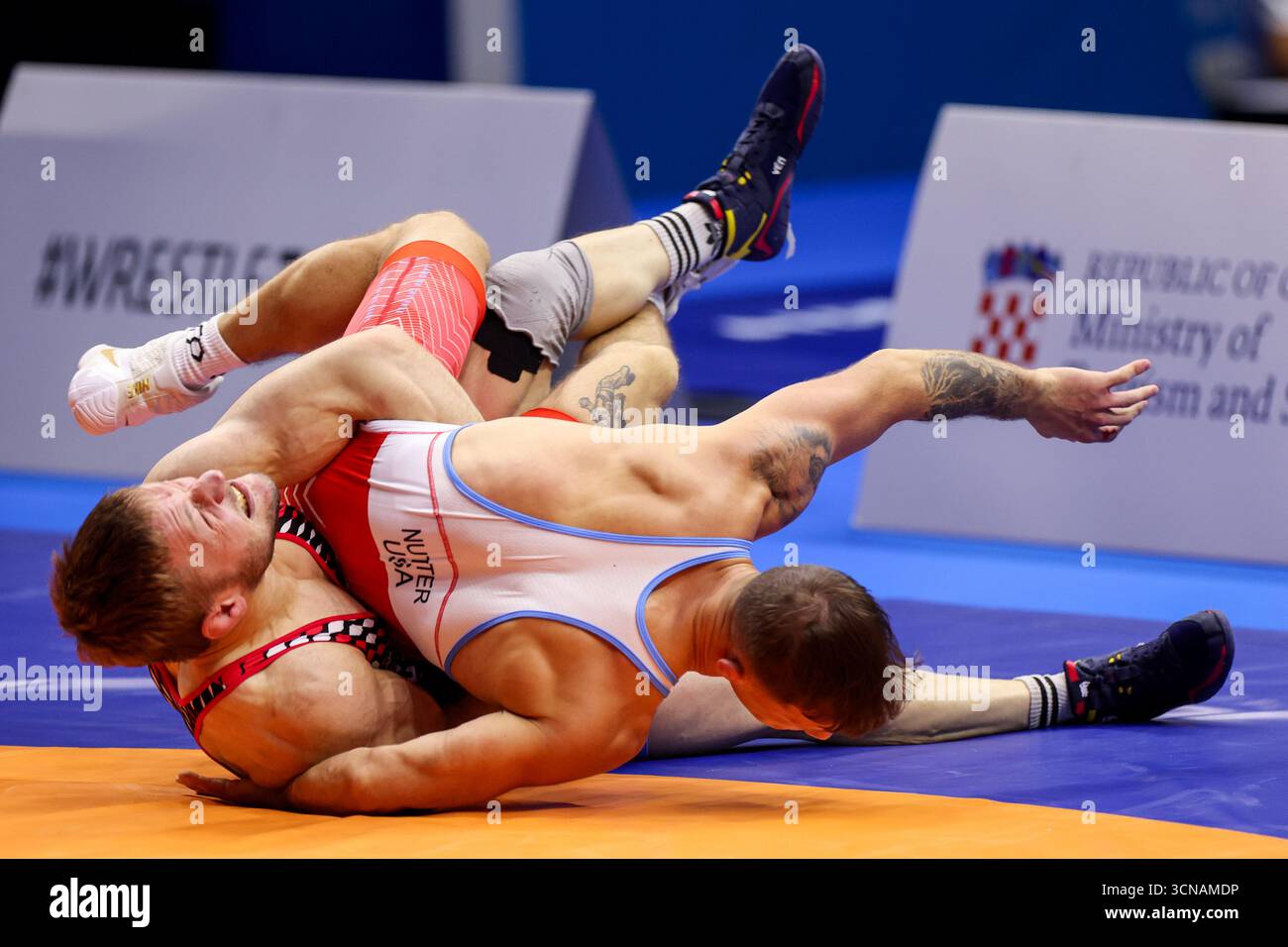 ZAGREB, CROATIA - SEPTEMBER 20: Alston J. Nutter of USA (red) competes ...