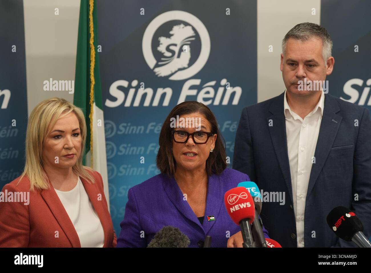 Sinn Fein party president Mary Lou McDonald (centre), stands with vice ...