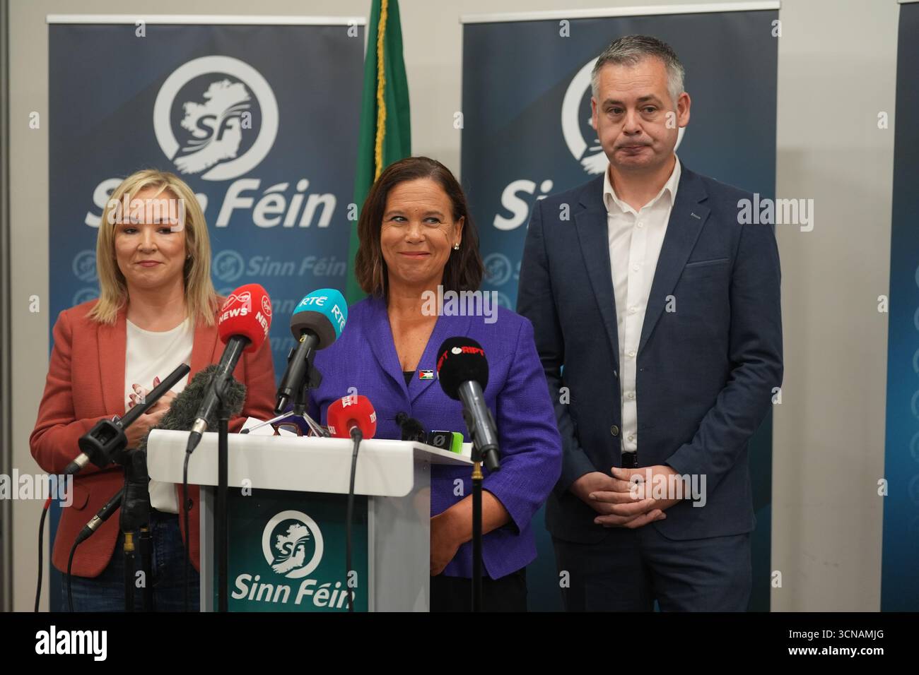 Sinn Fein party president Mary Lou McDonald (centre), stands with vice ...