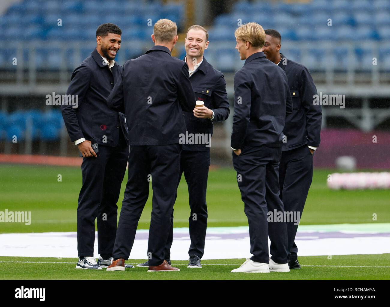 Burnley's Josh Laurent (left) and Ashley Barnes (centre) after the ...