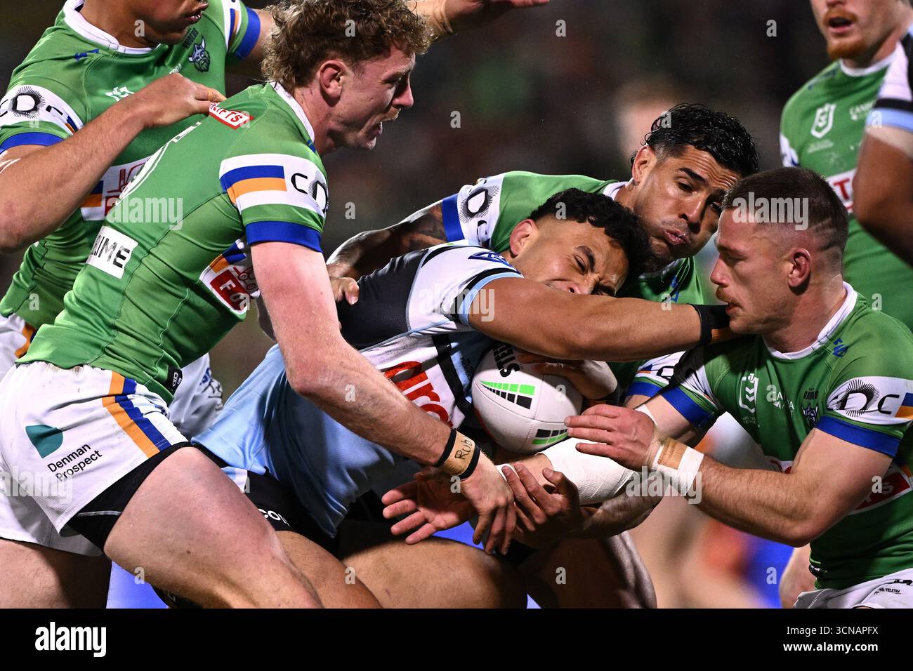 KL Iro of the Sharks is tackled Jed Stuart (left) Jamal Fogarty and Tom ...