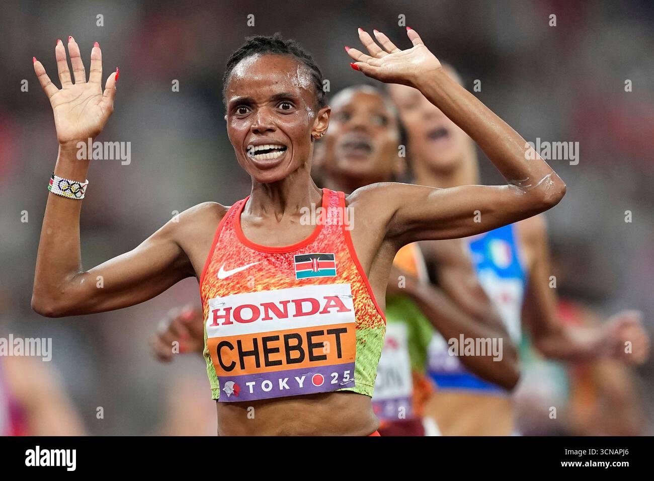 Kenya's Beatrice Chebet celebrates as she wins the gold medal in the ...