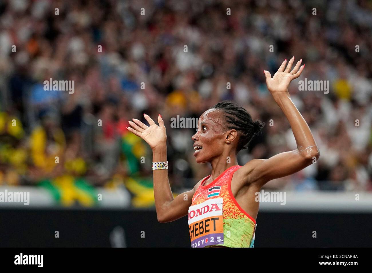 Kenya's Beatrice Chebet crosses the finish line to win the women's ...