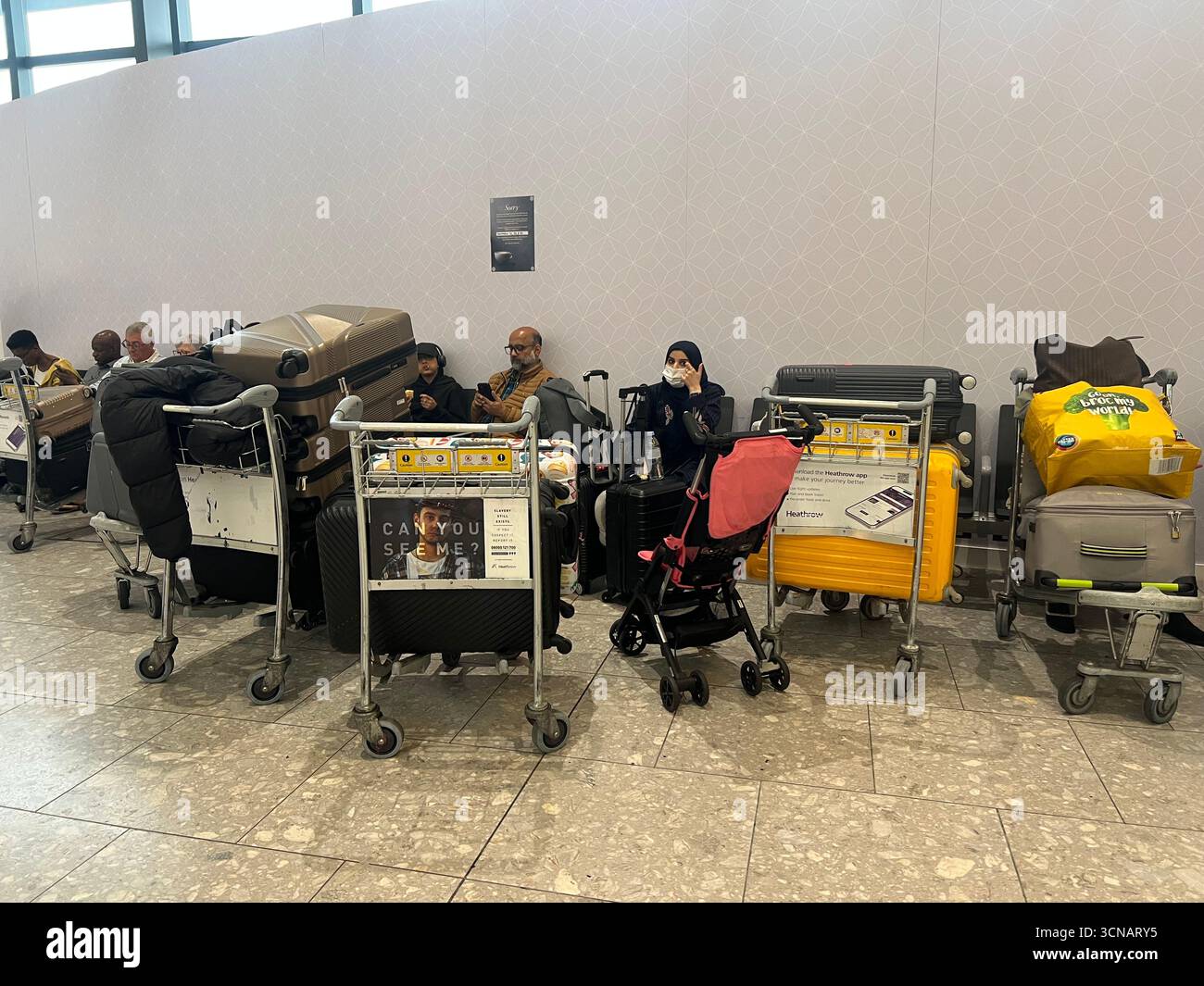 People at T4 London Heathrow Airport, after flights were delayed and ...