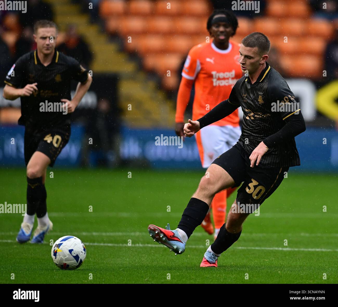 Barnsley's Jonathan Bland passes the ball in the match between Blackpool and Barnsley at ...