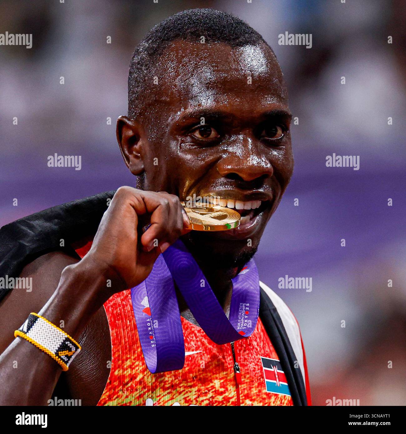 winner Emmanuel Wanyonyi of Kenya shows his gold medal and celebrates ...