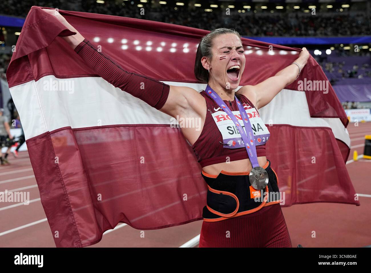 Latvia's Anete Sietina reacts after winning the silver medal in the ...